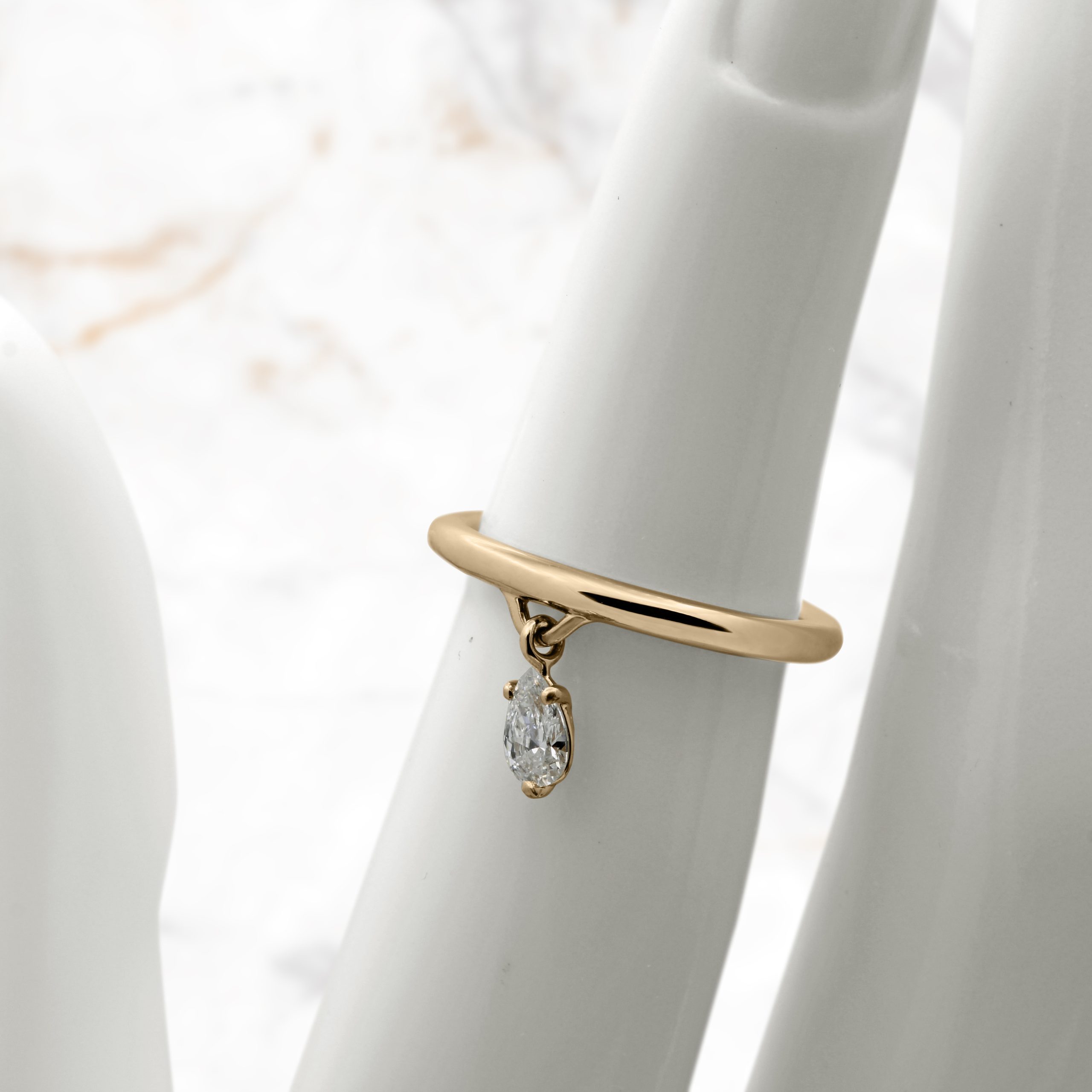 Gold Ring With Dangling Diamond » JewelryThis - Custom Jewelry